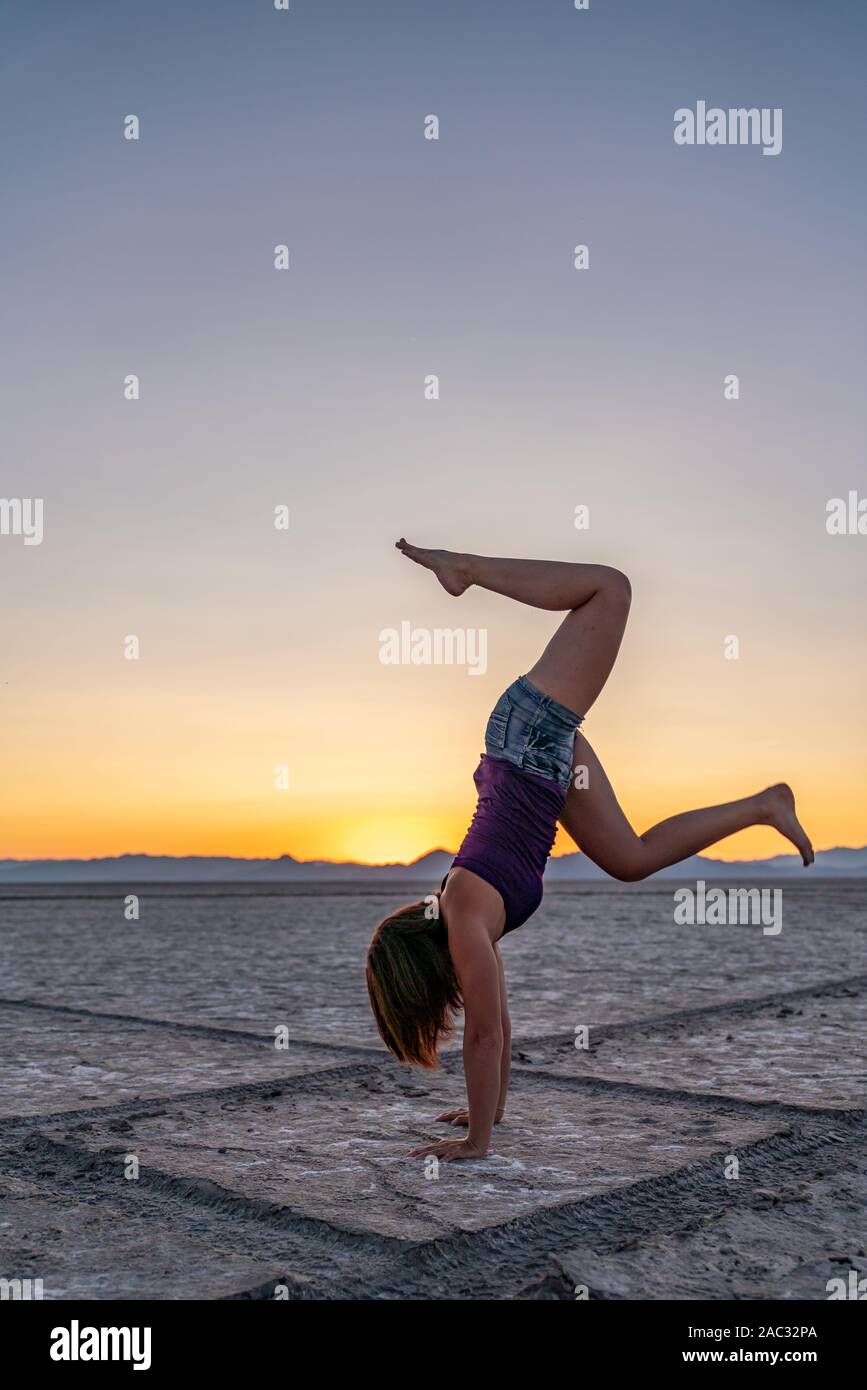 Beautiful Woman Doing Handstands During Sunset In the Bonneville Salt ...