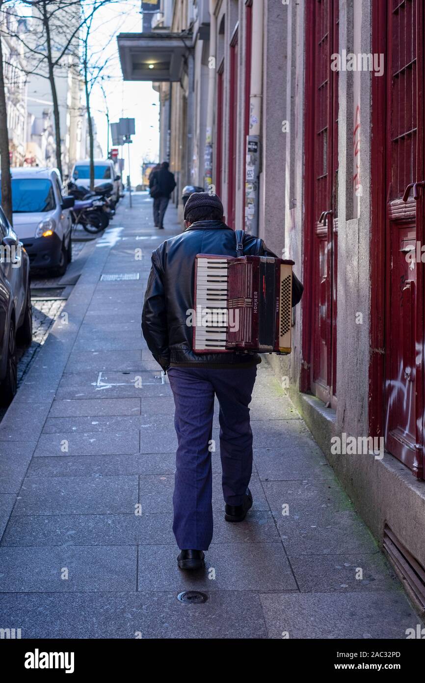 Street musician in Porto, Portugal, with accordian Stock Photo - Alamy