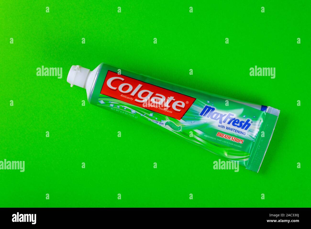 New York NY NOV 29 2019: Colgate toothpaste isolated on green ...