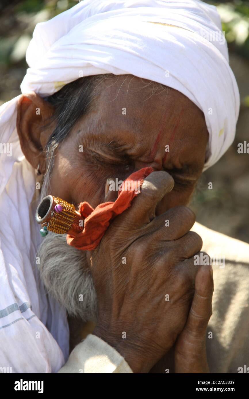 Indian man smoking tobacco with pipe jaipur hi-res stock photography ...