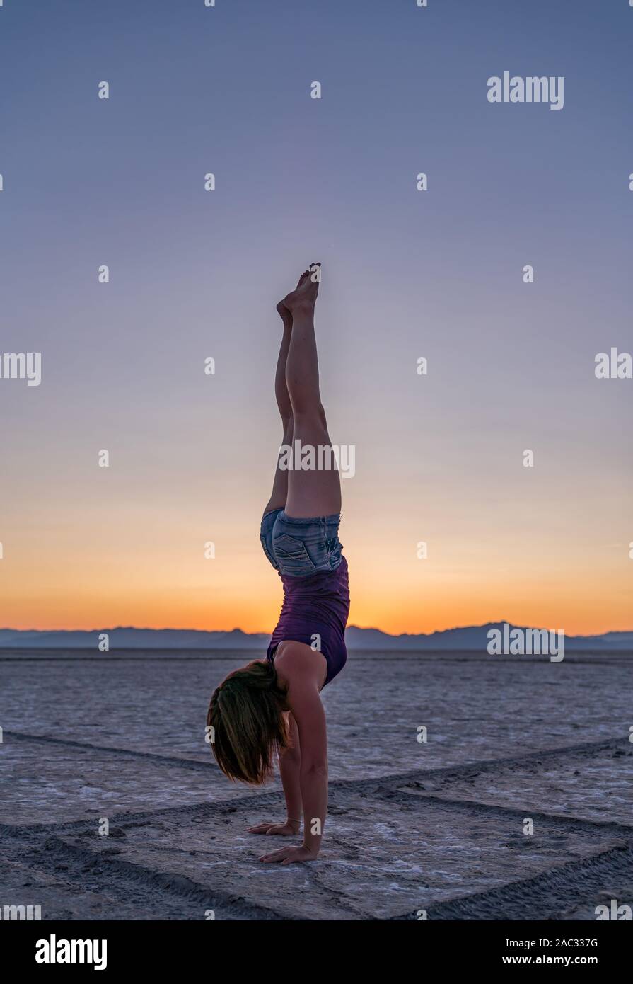 Beautiful Woman Doing Handstands During Sunset In the Bonneville Salt ...