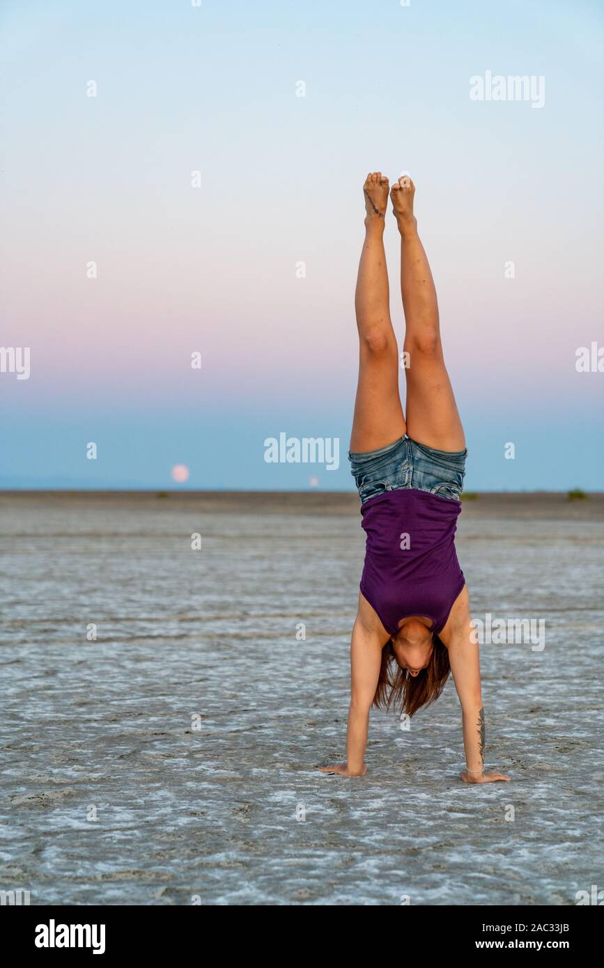 Beautiful Woman Doing Handstands During Sunset In the Bonneville Salt ...