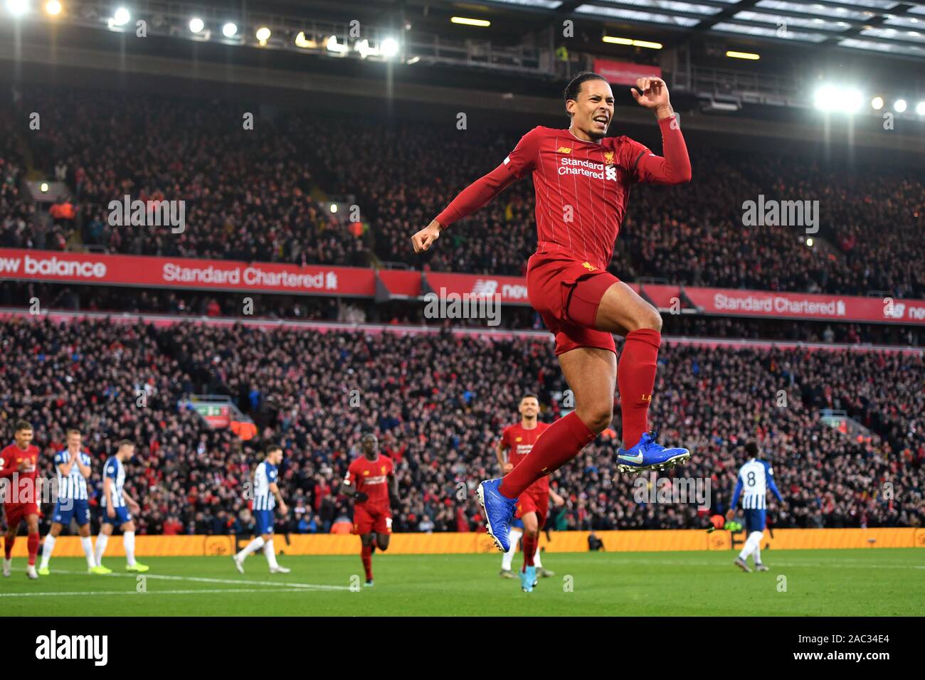 Liverpool's Virgil van Dijk celebrates scoring his second sides goal ...