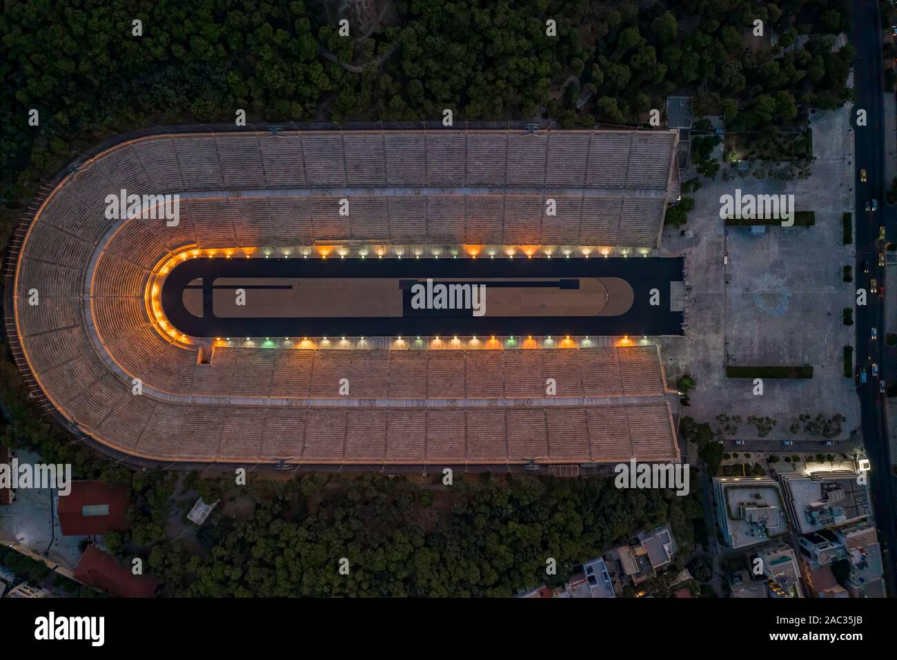 Overhead aerial drone shot of Panathenaic marble stadium with lights in ...