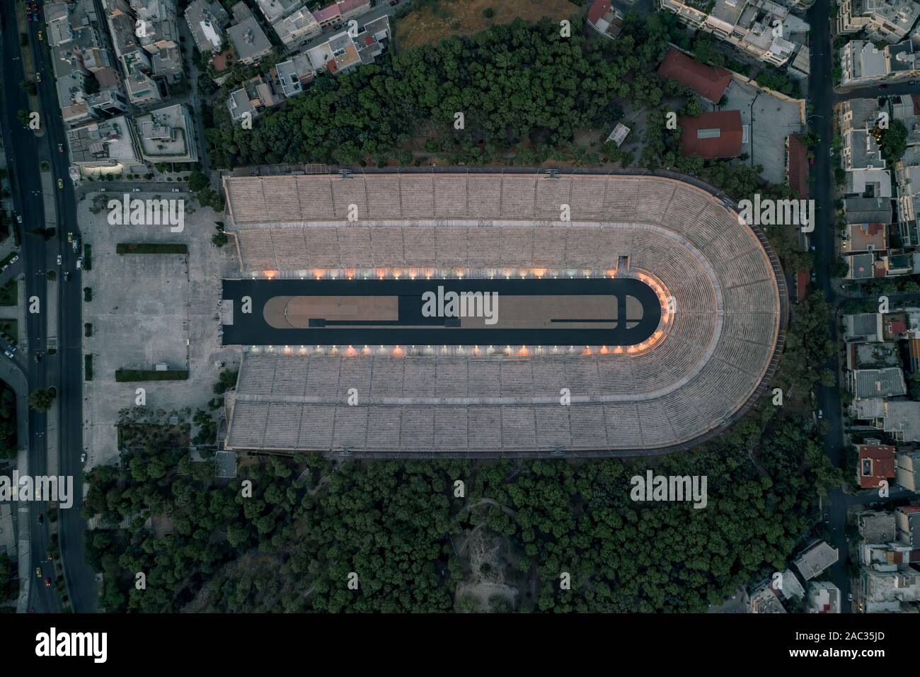 Overhead aerial drone shot of Panathenaic marble stadium with lights in ...