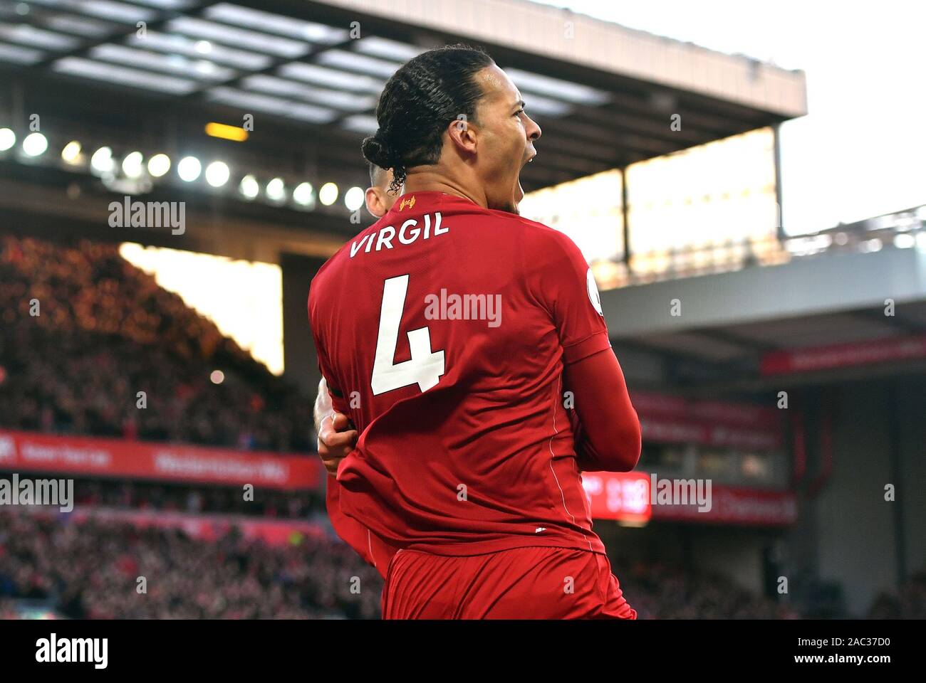 Liverpool's Virgil van Dijk celebrates scoring his sides first goal ...