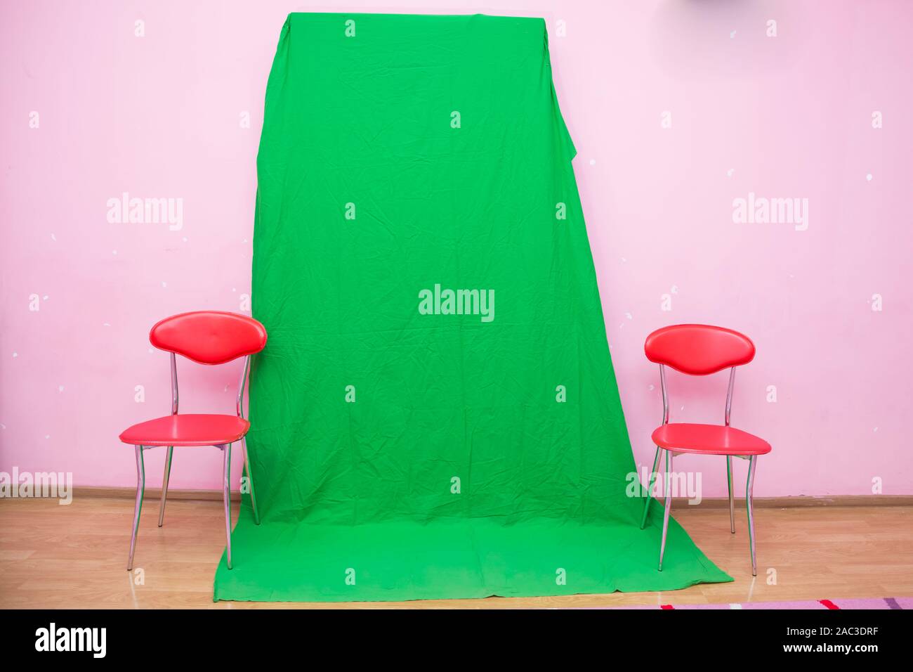 green screen chroma key background on commercial set. Big green ...