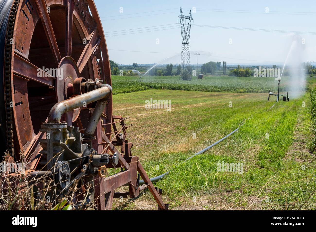 Irrigation equipment with the automatic winding mecanism in foreground ...