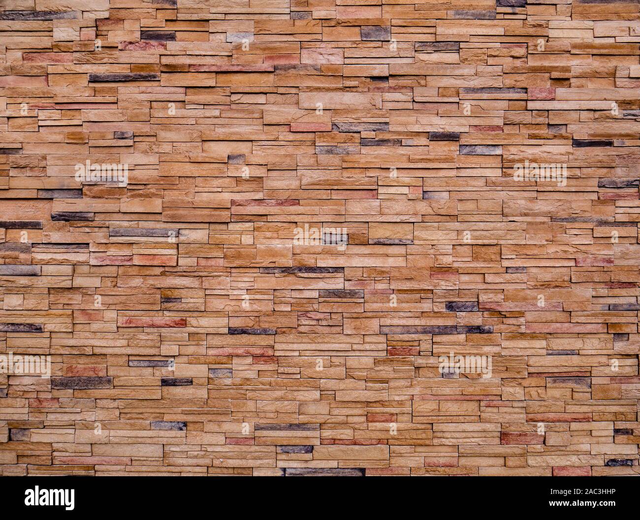 Decorative brown stone setting. Cut stone wall texture Stock Photo - Alamy