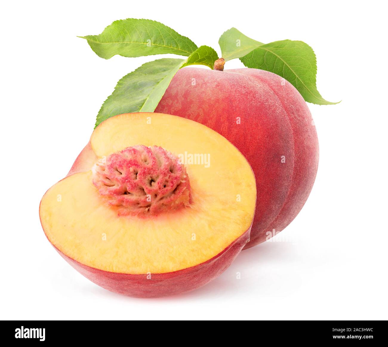 Isolated peach fruits. One whole pink peach and one half isolated on ...