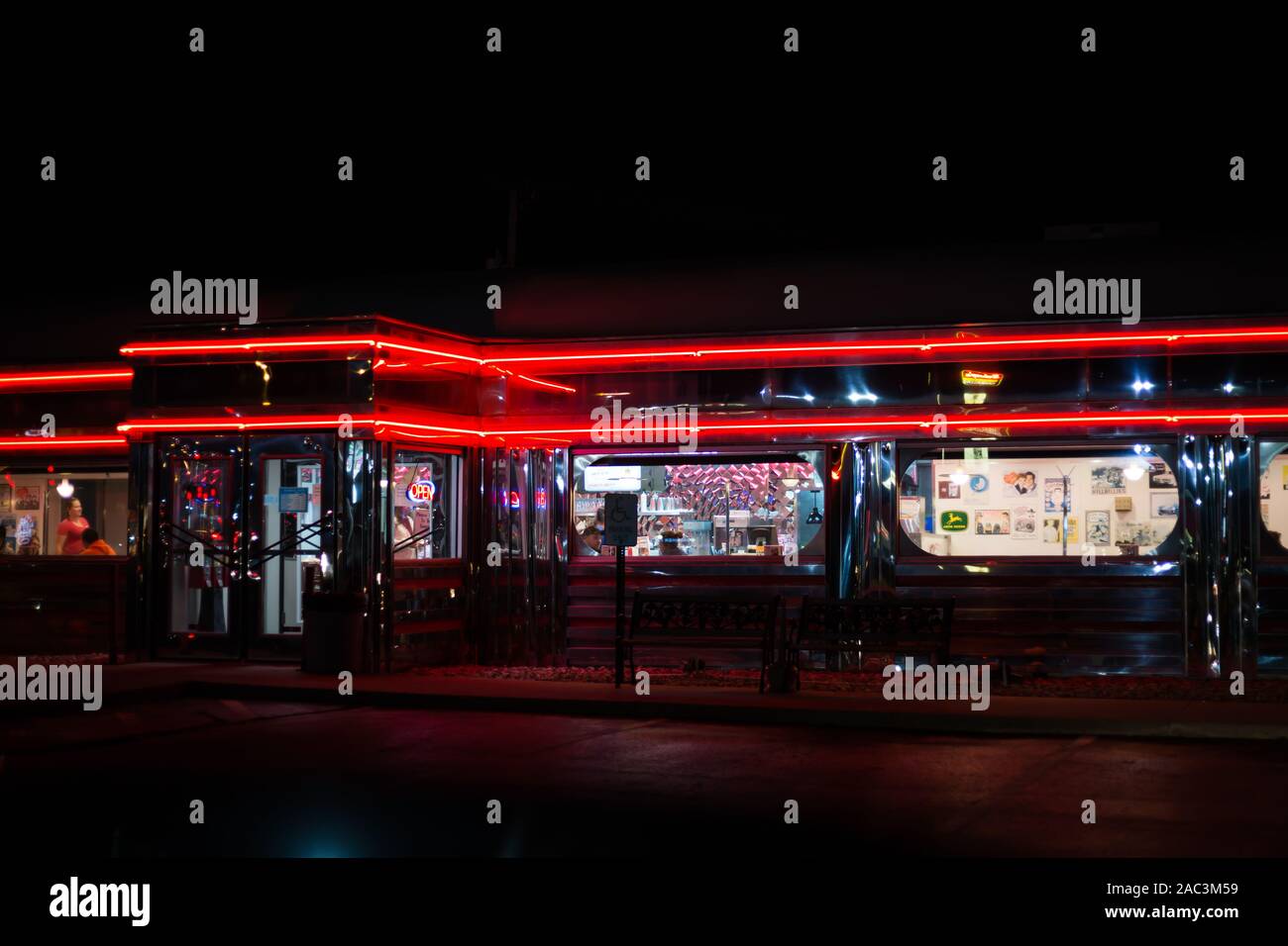 Red neon lights identify the iconic Schoop's Hamburgers diner along ...