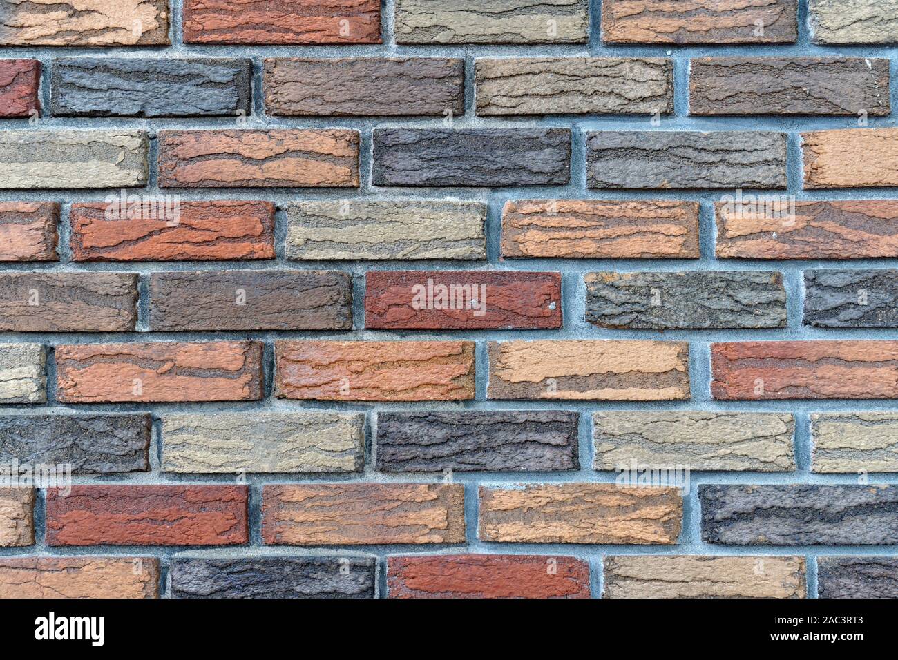 Closeup of a colorful brick wall made of multicolored bricks Stock ...