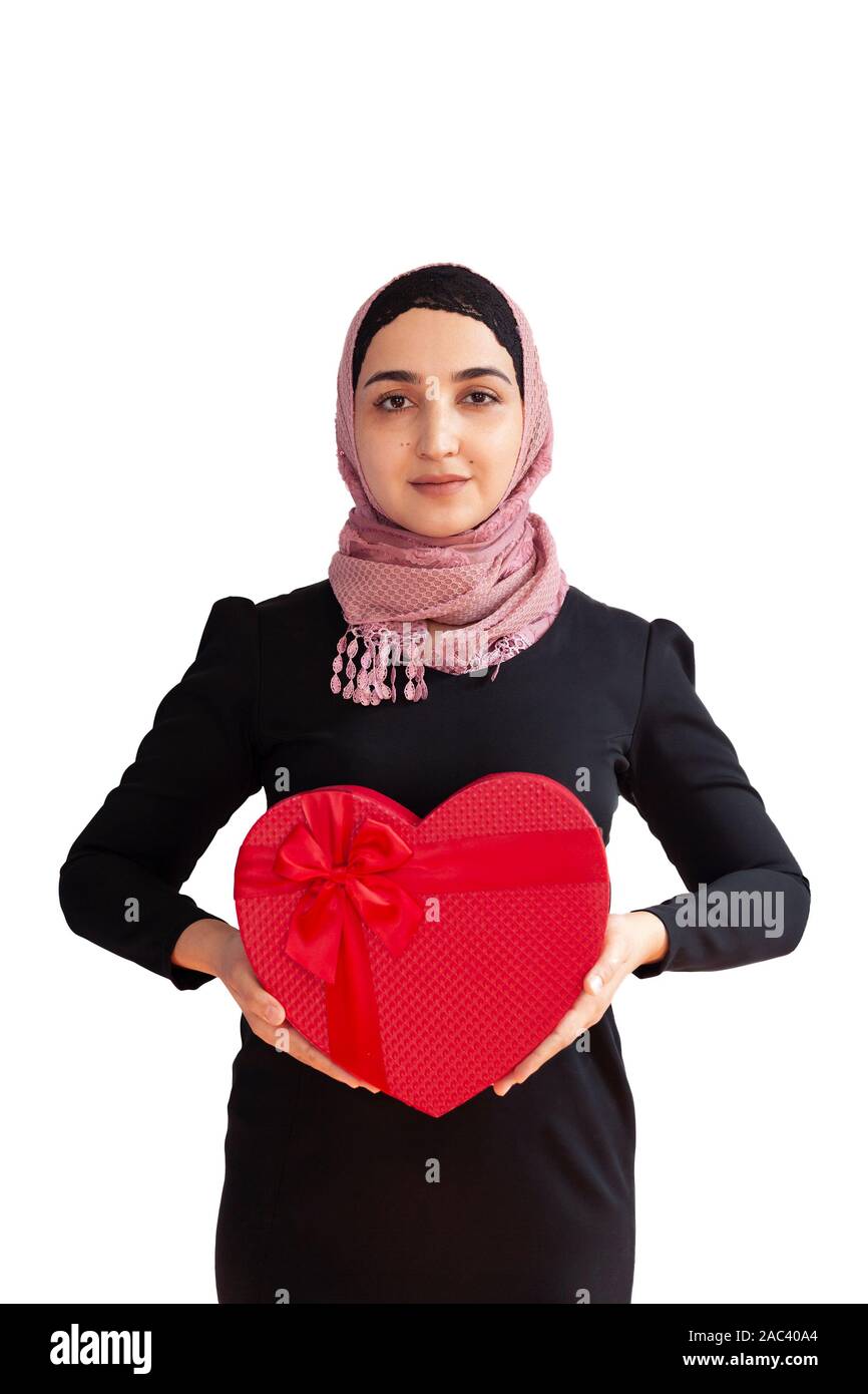 Muslim girl receiving a big present. Iranian woman holding a gift box ...