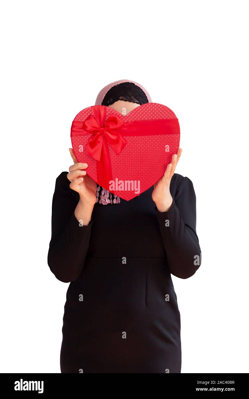 Muslim girl receiving a big present. Iranian woman holding a gift box ...
