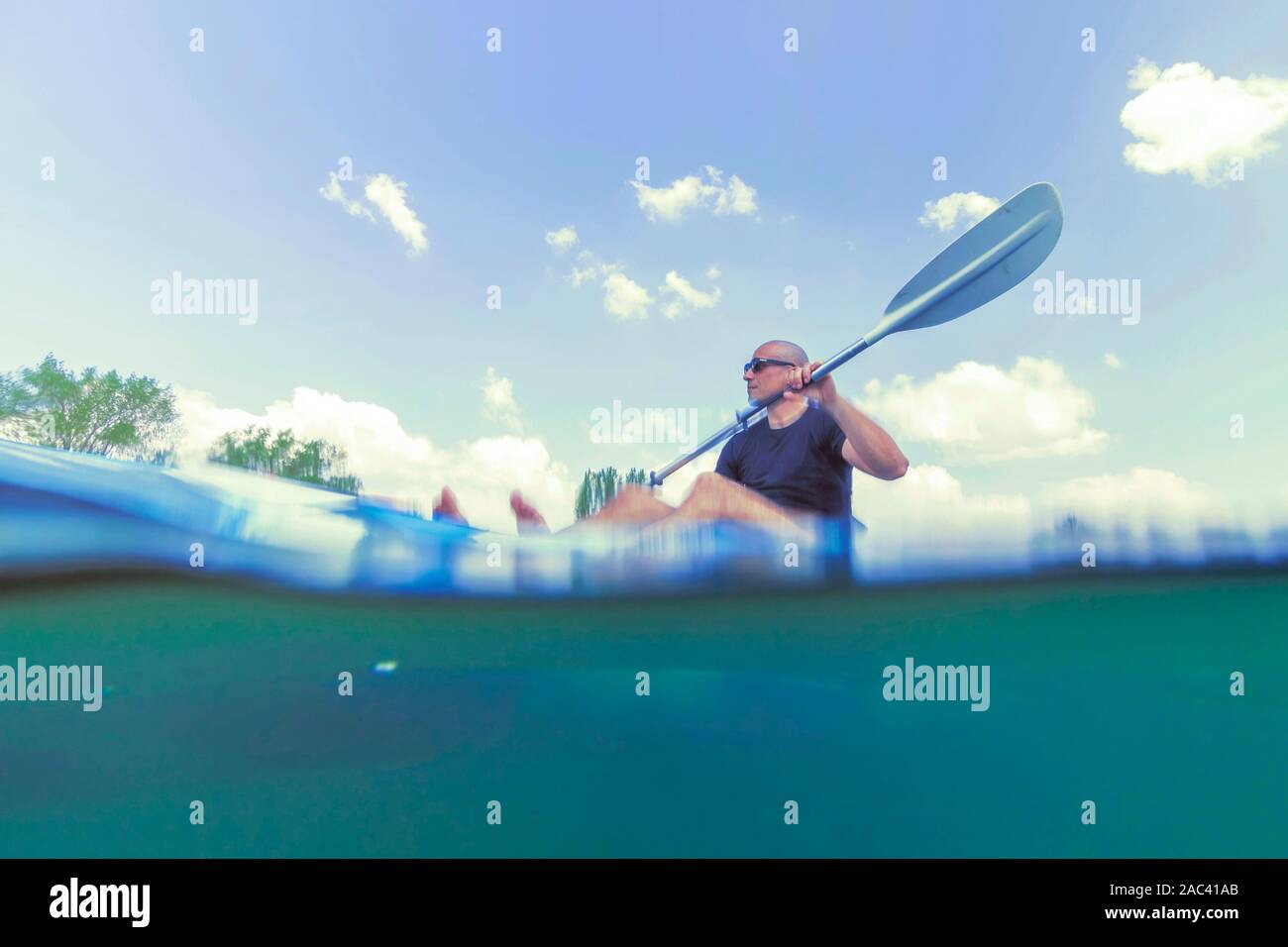 Young Man Kayaking on Lake, Kayaking Underwater View, Split Shot Stock ...