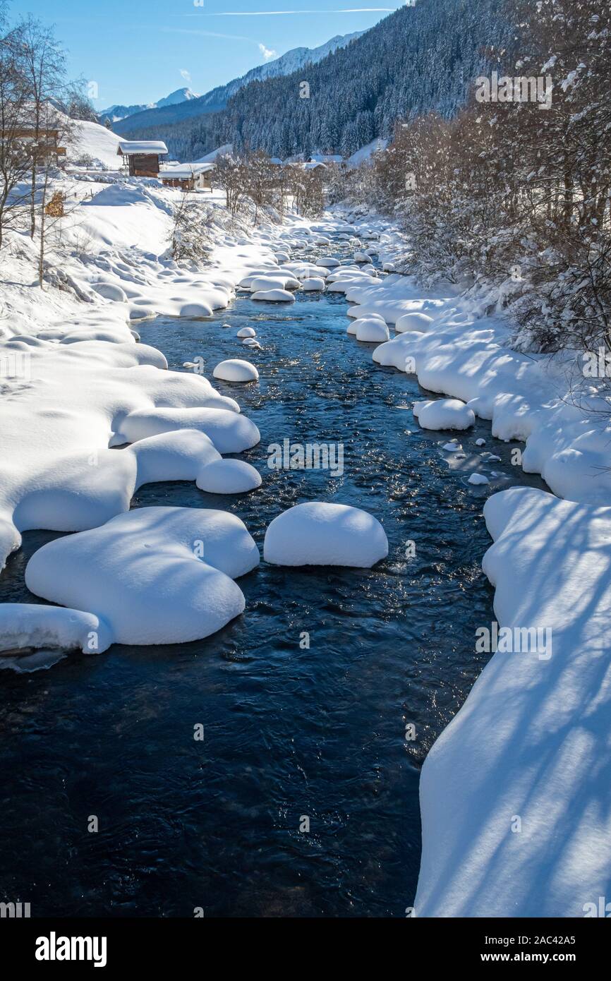 Panoramic view of a snowy creek on a sunny day. Val Ridanna, South ...