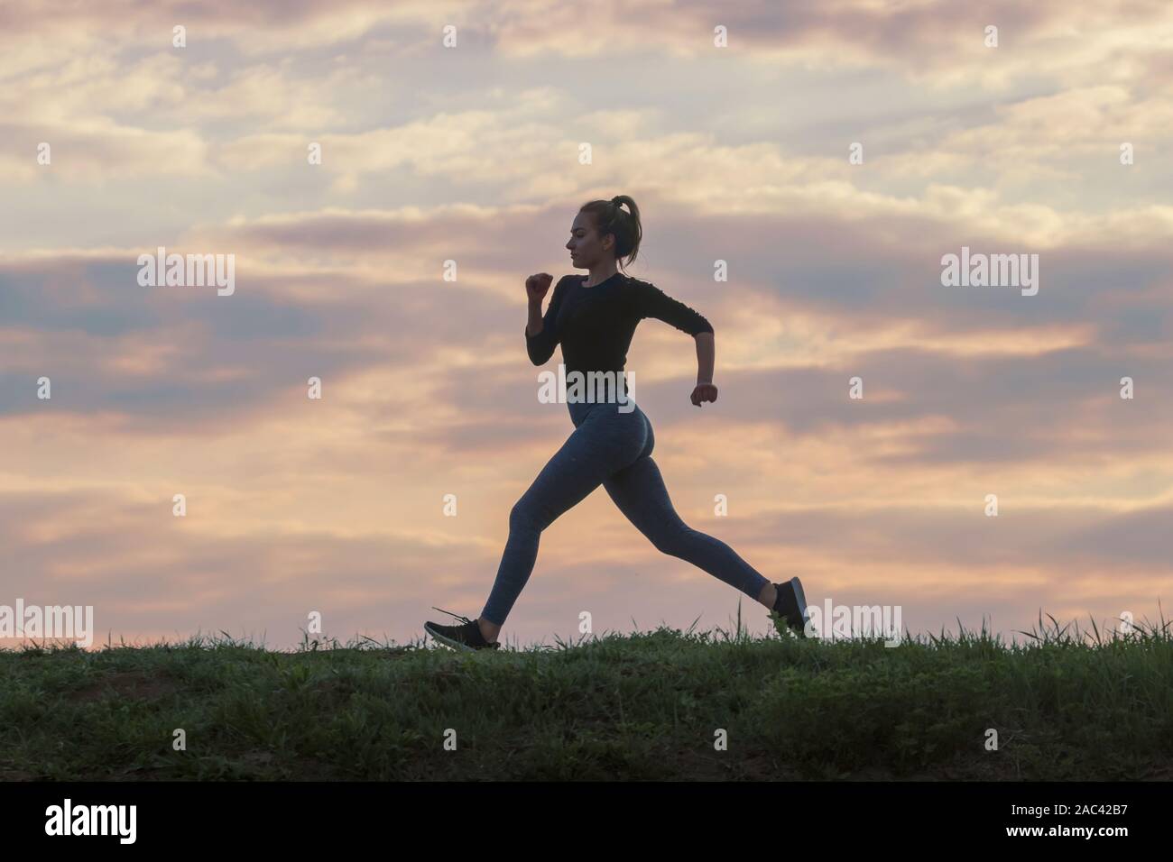 Running woman morning workout. Female Runner. Jogging during sunrise ...