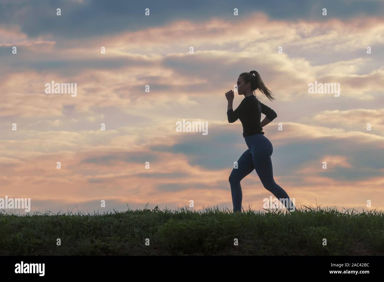 Running woman morning workout. Female Runner. Jogging during sunrise ...