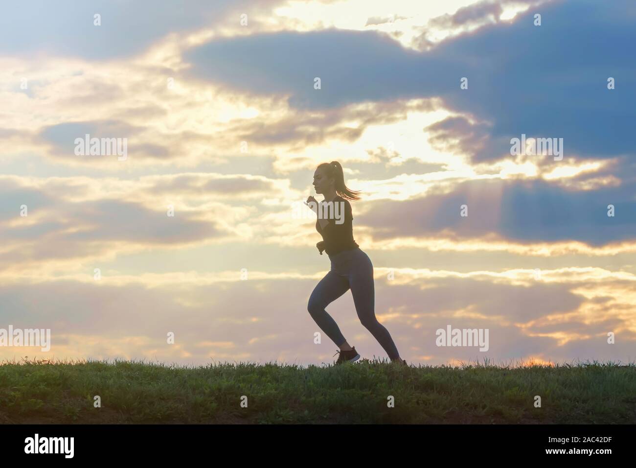 Running woman morning workout. Female Runner. Jogging during sunrise ...