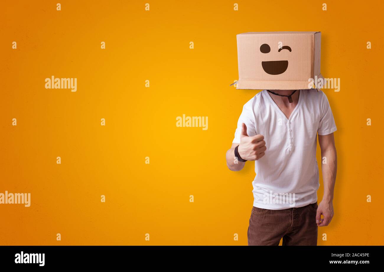 Funny man wearing cardboard box on his head with smiley face Stock ...