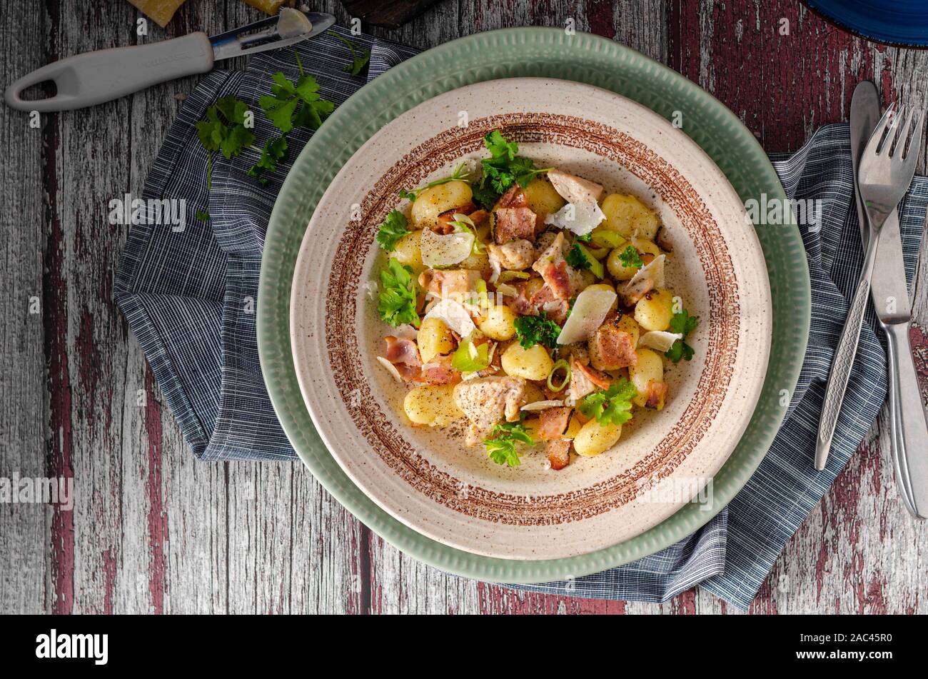 Delicious meal with fresh herbs, parmesan cheese and homemade gnocchi ...