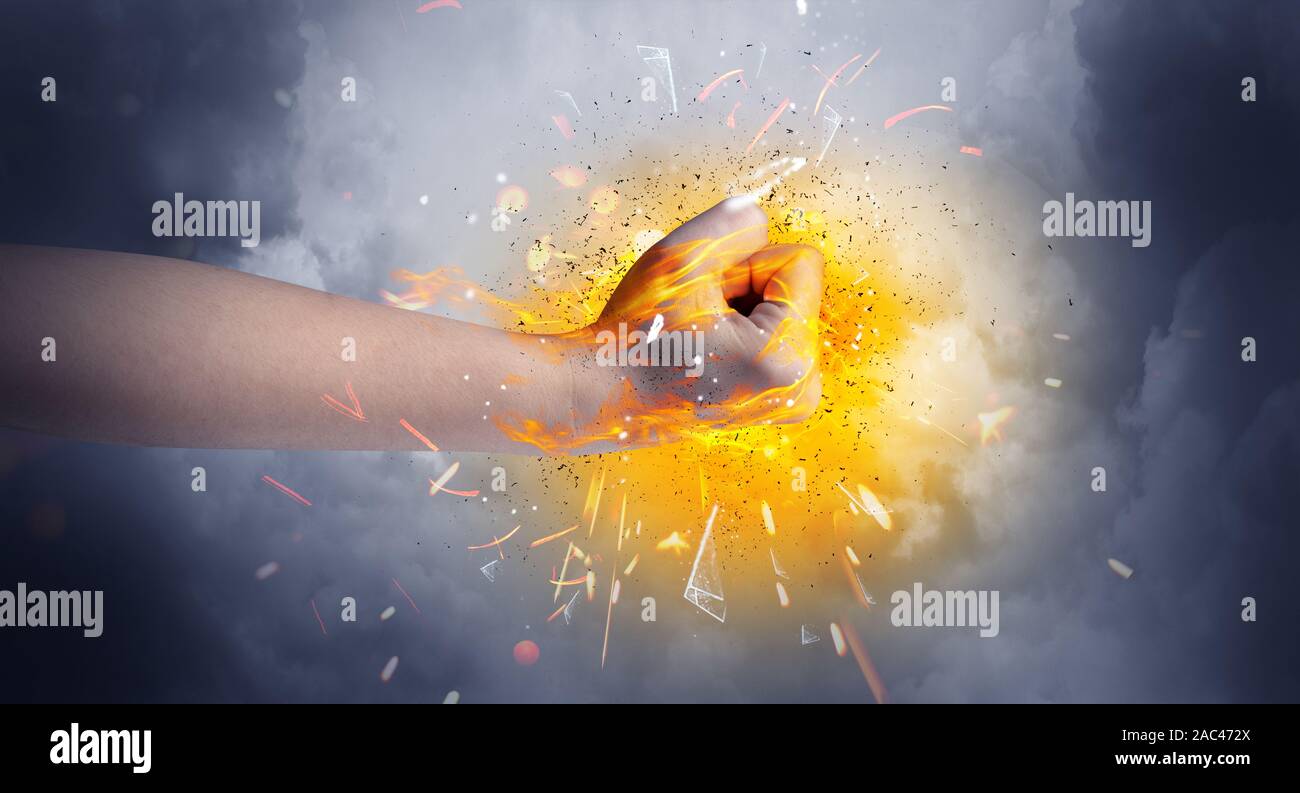 Hand hits strongly and makes fire beam around Stock Photo - Alamy