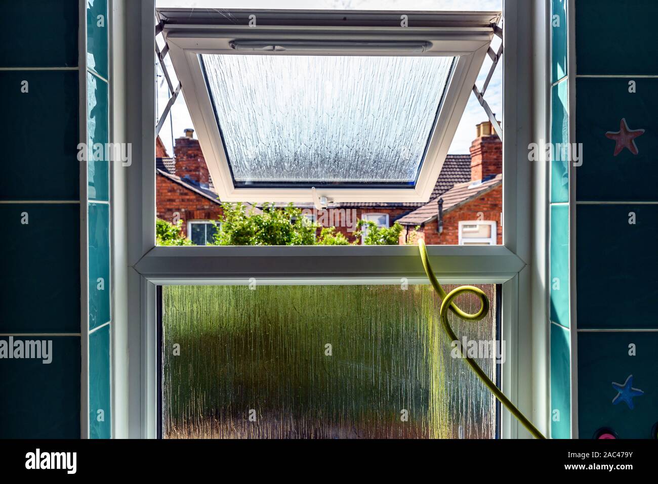 open bathroom plastic window with water pipe through it in england uk ...