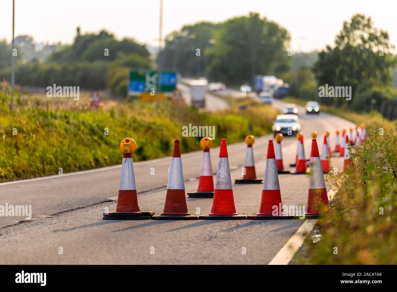 sunset view uk motorway services roadworks cones Stock Photo - Alamy