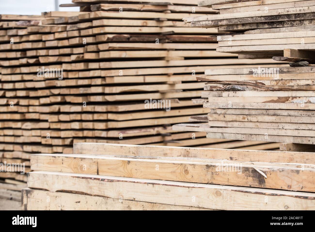 Eaves board in stacks outside Stock Photo - Alamy