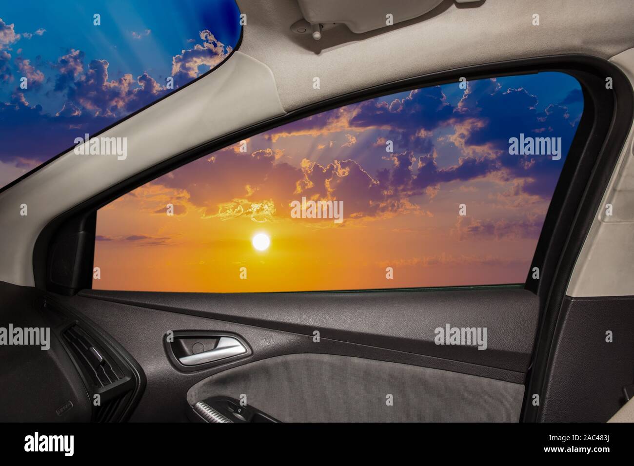 beautiful sunset from the car window Stock Photo - Alamy