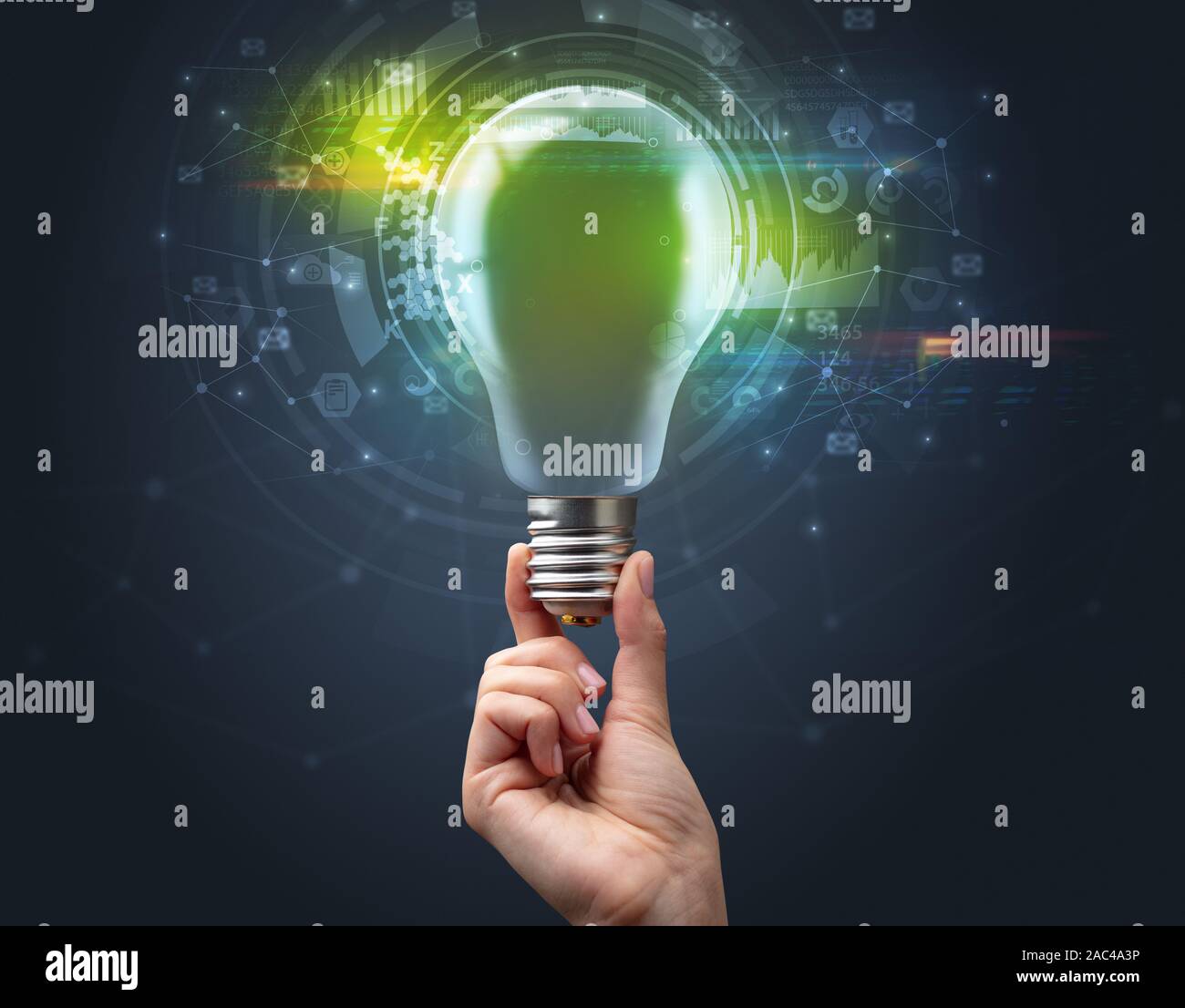 Hand holding light bulb on dark background. New business idea concept ...