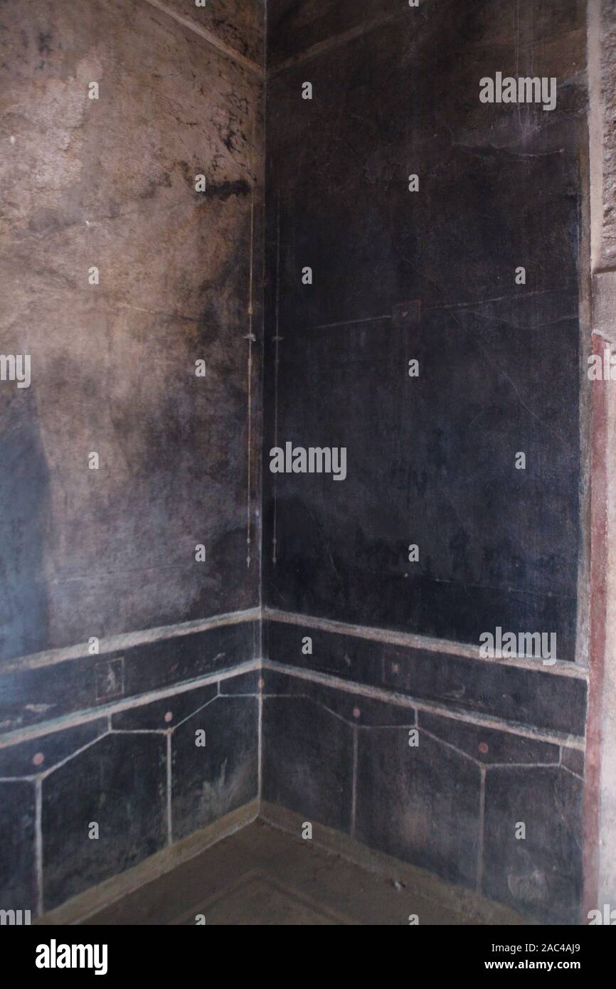 Black fresco on the wall in villa of the mysteries in Pompeii (Pompei ...