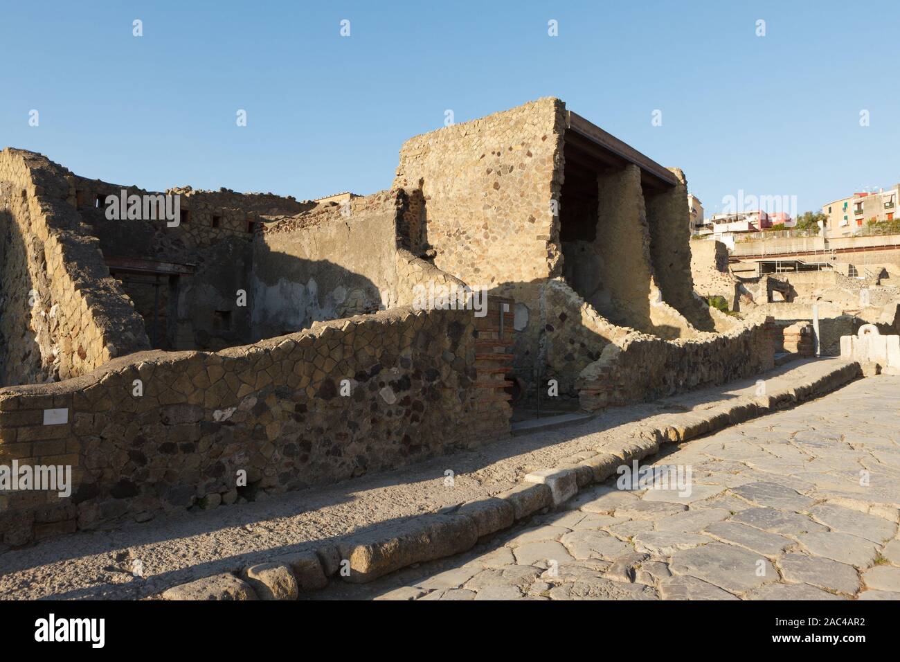 Street in ancient Ercolano (Herculaneum) city ruins. Naples, Campania ...