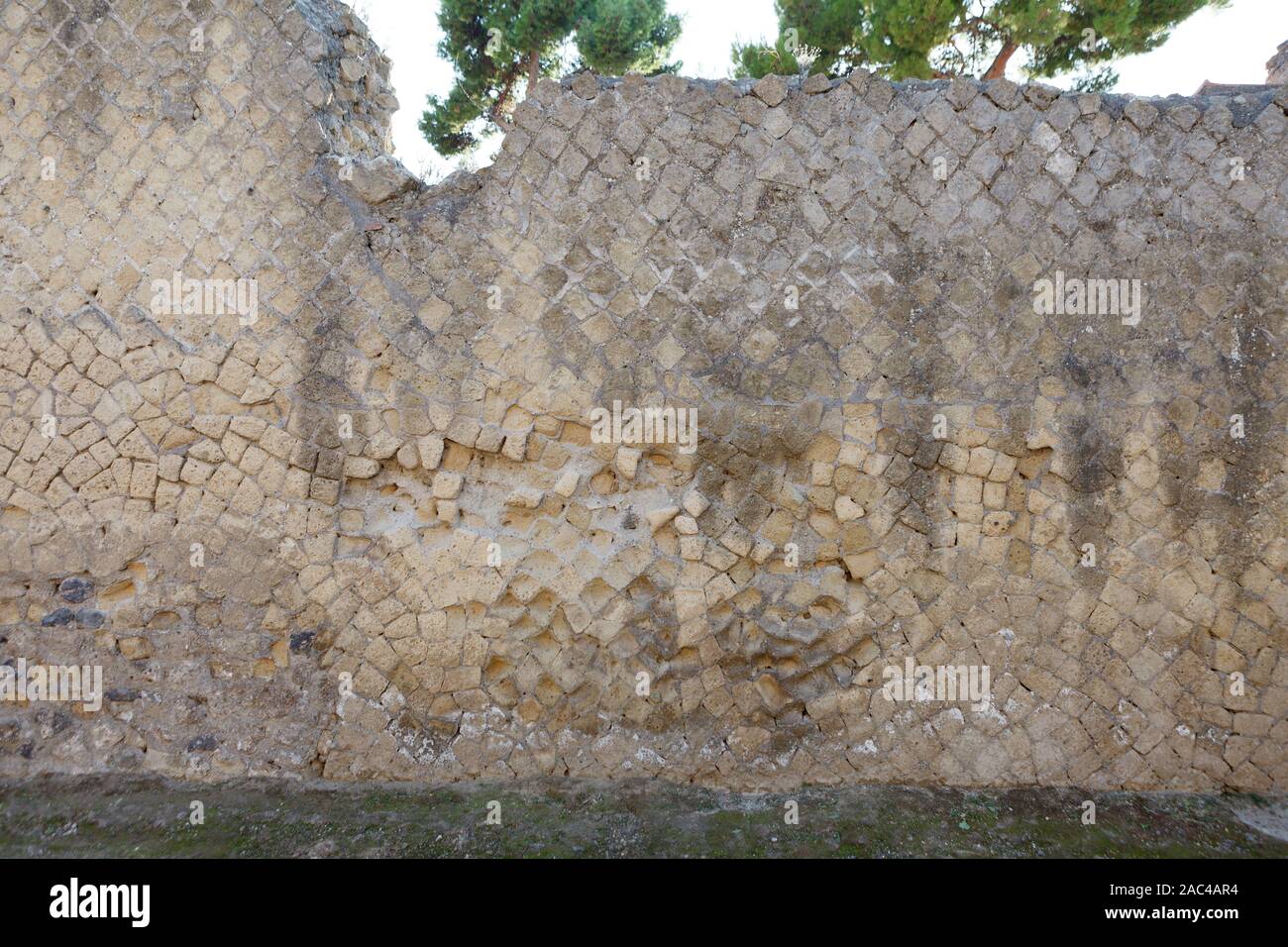 Opus reticulatum brickwork in Ancient Ercolano (Herculaneum) city ruins ...