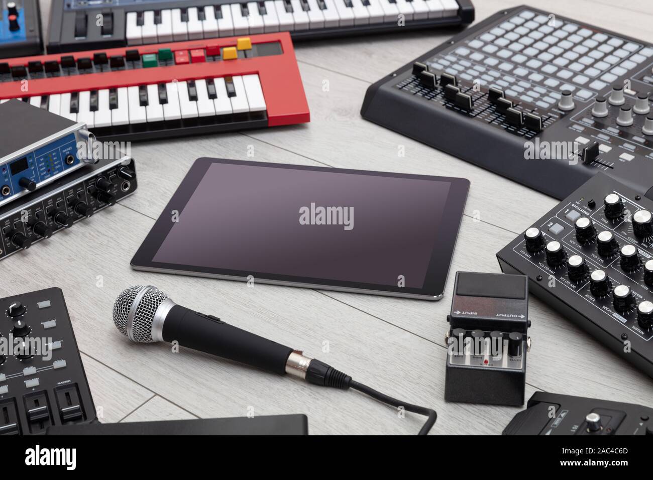 Empty tablet and electronic music instruments Stock Photo - Alamy