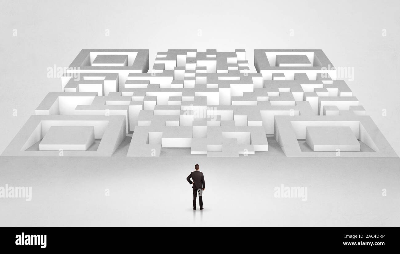 Businessman standing and thinking in top of a huge maze Stock Photo - Alamy