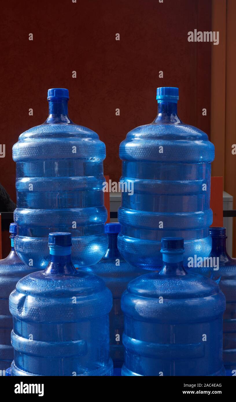 The Blue plastic water barrels Stock Photo - Alamy
