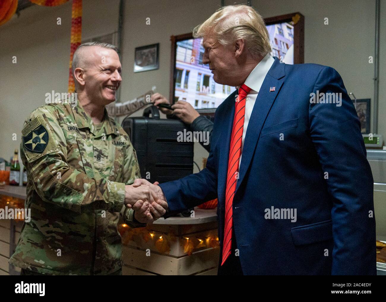 U.S. President Donald Trump shakes hands with Army Command Sgt. Maj ...