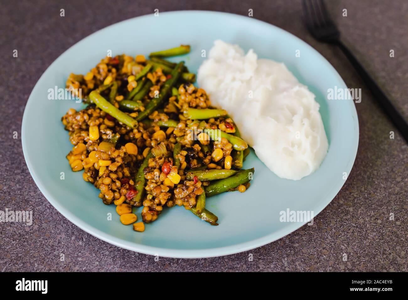 healthy plant-based recipes concept, mixed sauteed veggies cous cous ...