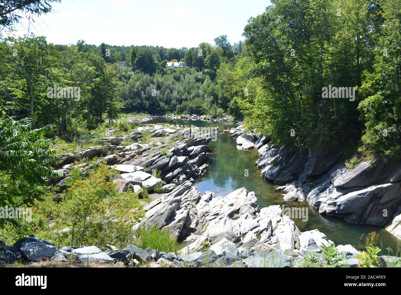 Quite river in New England with worn rocks Stock Photo - Alamy