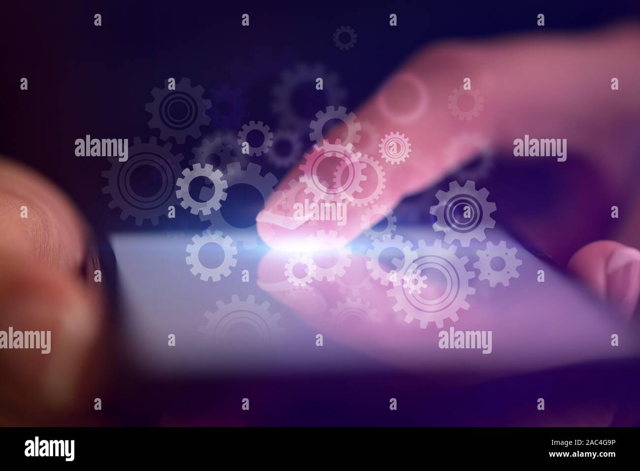 Finger setting the phone with dark background Stock Photo - Alamy