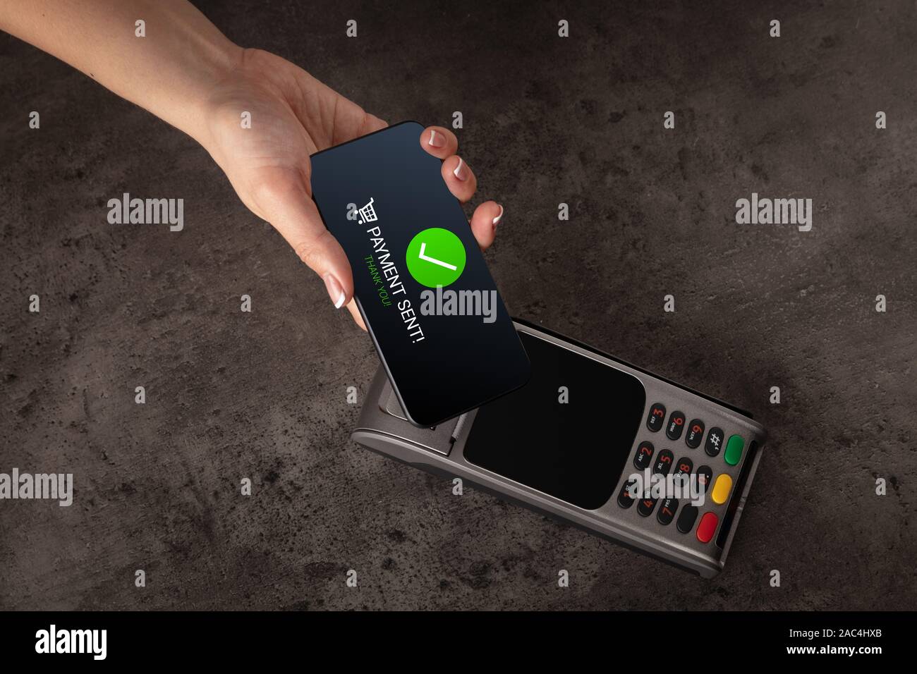 Mobile payment accepted on terminal Stock Photo - Alamy