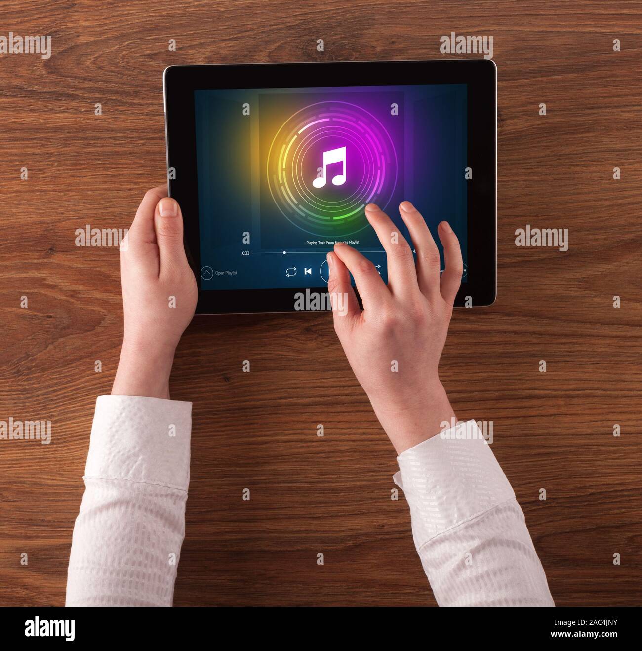Hand touching tablet with music play concept Stock Photo - Alamy