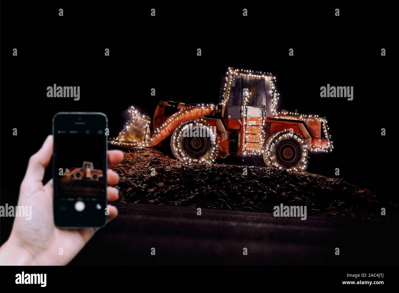 Mobile picture of a Blurred wheel loader decorated with lights at ...
