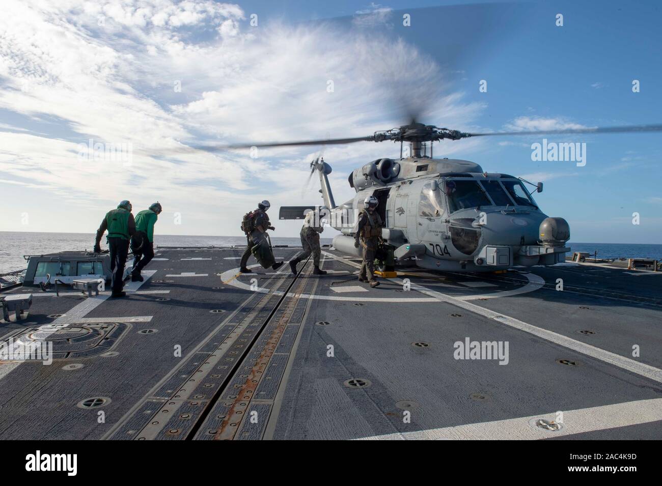 PACIFIC OCEAN (Nov. 22, 2019) Sailors board an MH-60R Sea Hawk ...