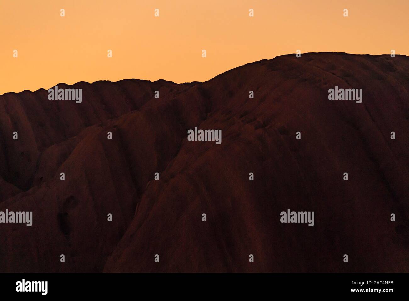 Silhouette of sunset at Uluru. Uluru, Northern Territory, Australia ...