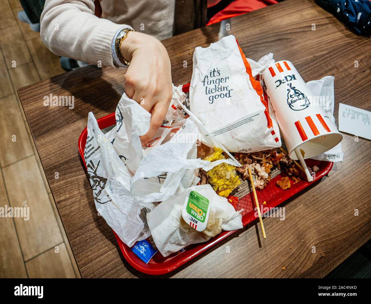 Nice, France - Nov 24, 2019: Overhead view of tray with female hand ...