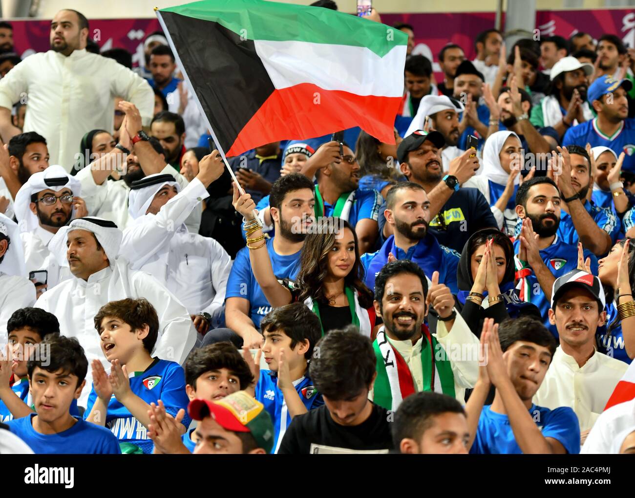 Doha, Qatar. 30th Nov, 2019. Supporters of Kuwait cheer for the team ...