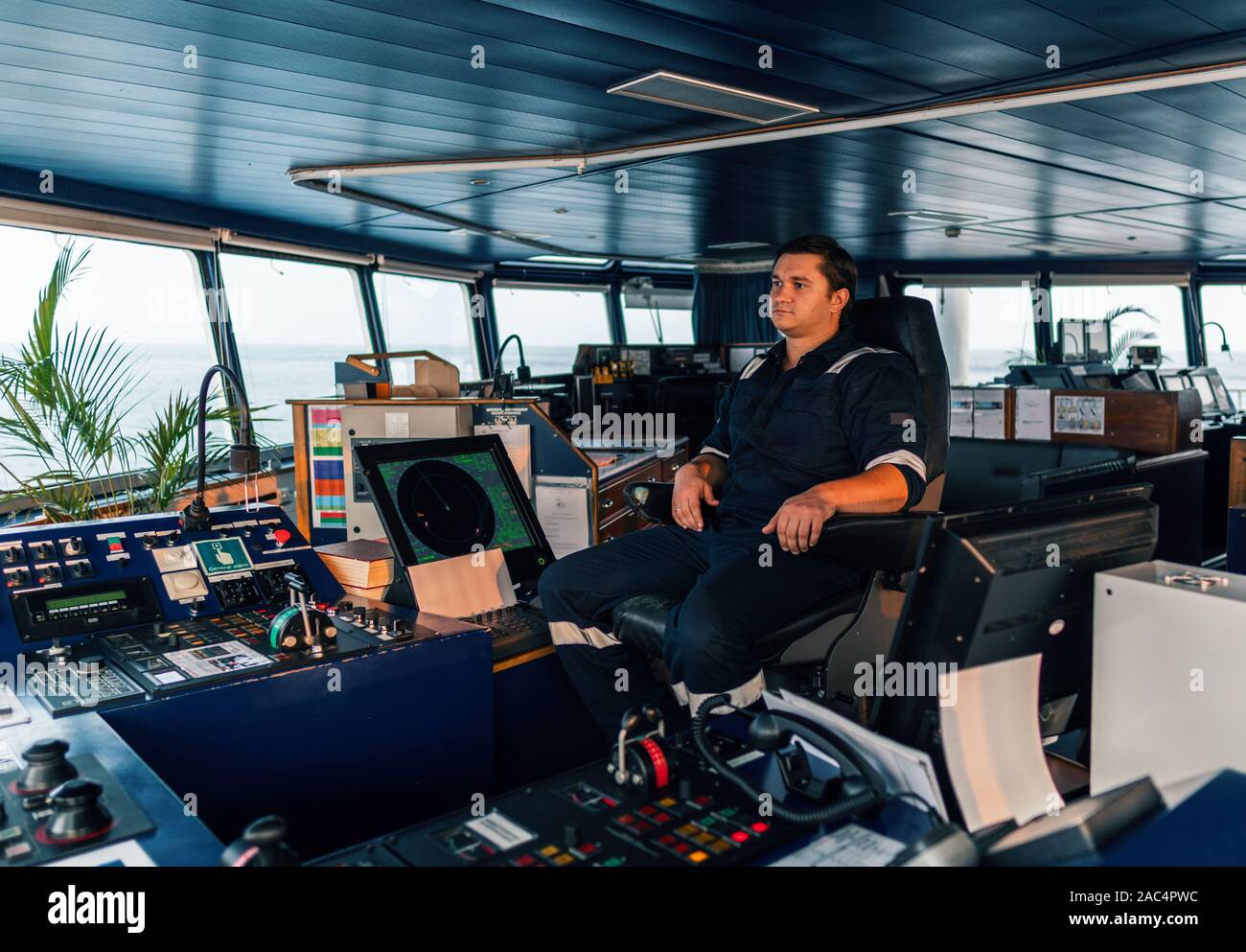 Marine navigational officer during navigational watch on Bridge . Work ...