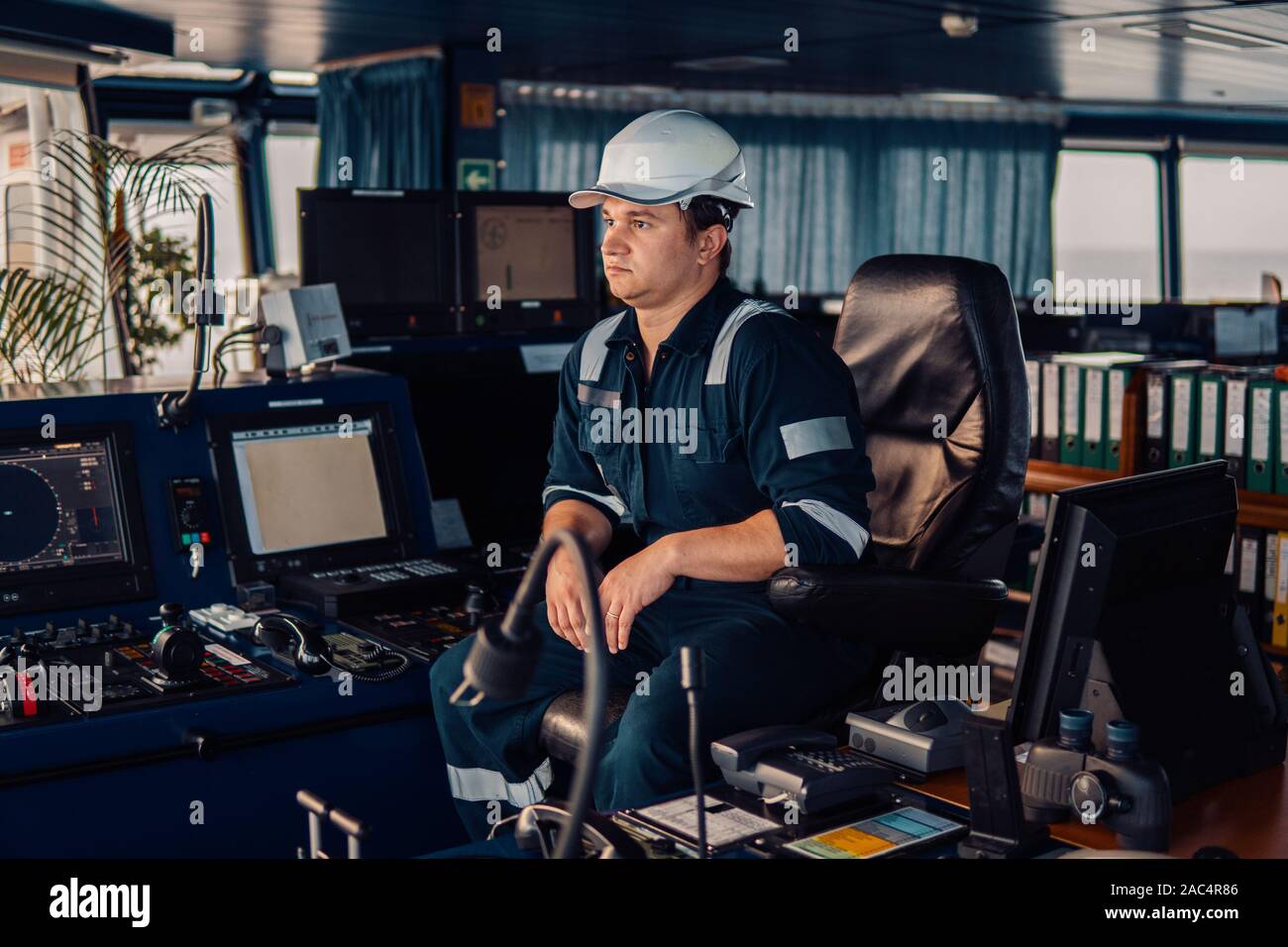 Marine navigational officer during navigational watch on Bridge . Work ...